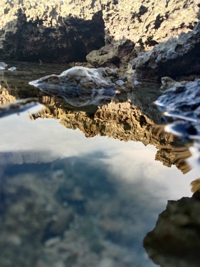 Reflections in a Tranquil Coastal Pool Stock Photo - Image of geology ...