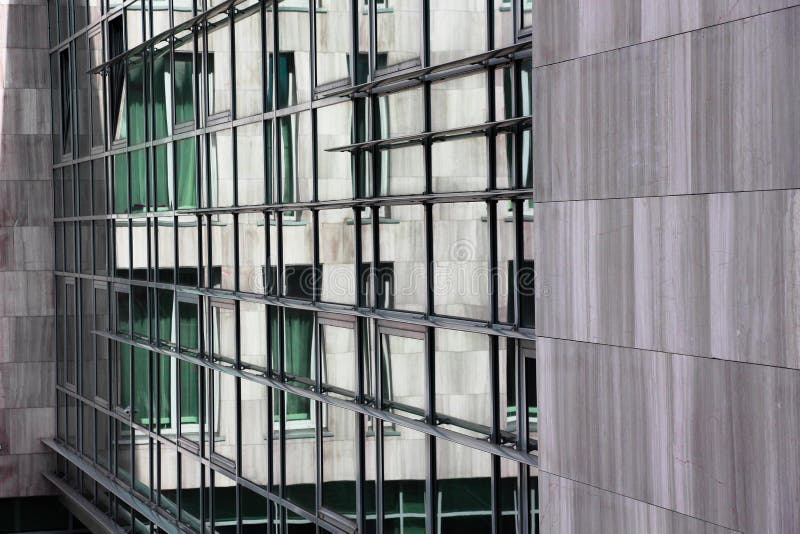 Reflections of Windows in the Windows of the Building. the Gray Wall of ...