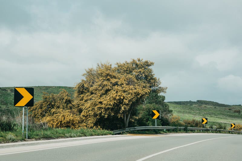 Reflective Direction Indicators on the Road. Stock Image - Image of ...