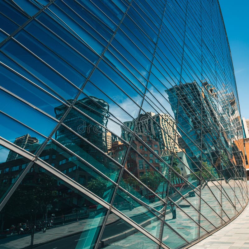 Reflective Glass Facade of a Modern Building, Showcasing a Geometric ...