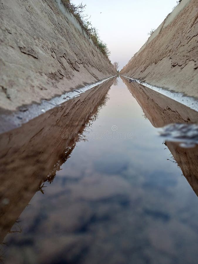 Reflective Perspective: the Endless Illusion of a Water Canal Stock ...