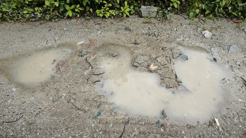 Reflective Potholes of Stagnant Rainwater at the Rural Dirt Road. Stock ...
