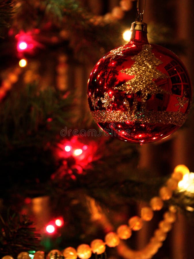 Reflective Red Christmas Ball Ornament on Tree Stock Photo - Image of ...