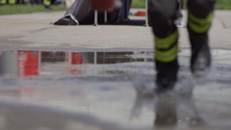A Reflective Scene Captures a Firefighter Heading into a Dangerous ...