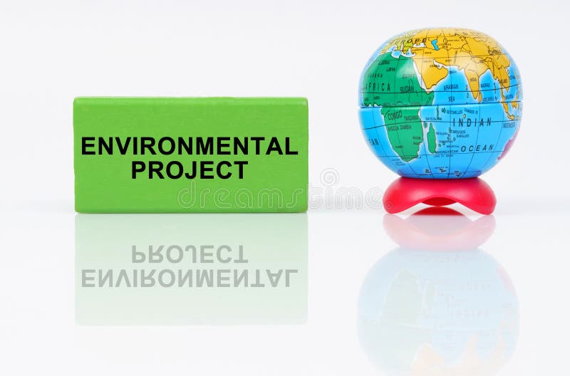 On a Reflective Surface is a Globe and a Green Sign with the ...