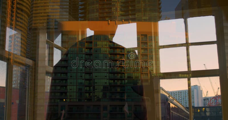 Reflective Urban Silhouette with Sunset Backdrop Evokes Contemplation ...