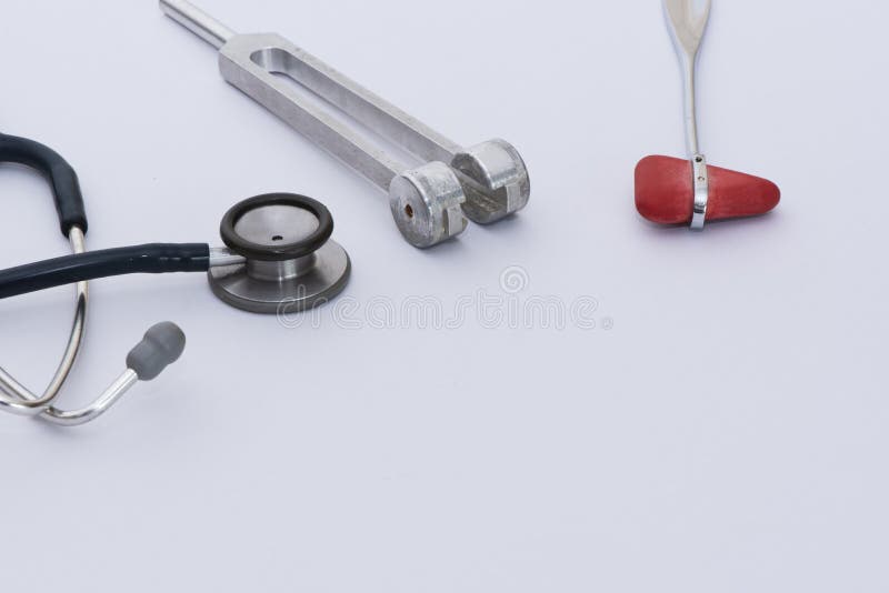 A Reflex Hammer, Tuning Fork, Stethoscope On White Background Stock ...