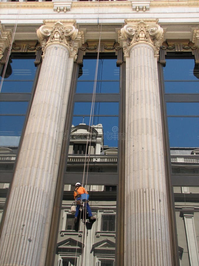 Reflexing Building As a Mirror with Cleaner People Stock Photo - Image ...