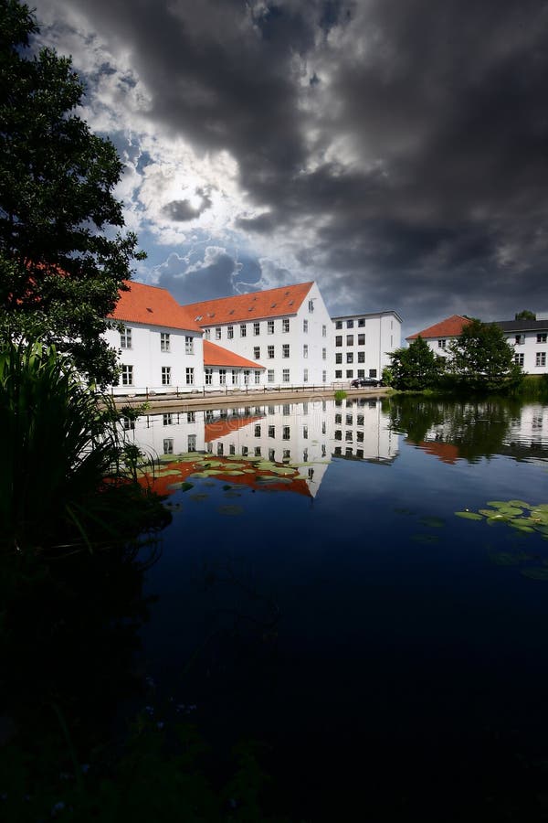 Traditional Building Built in Front of a Lake in Denmark Stock Image ...