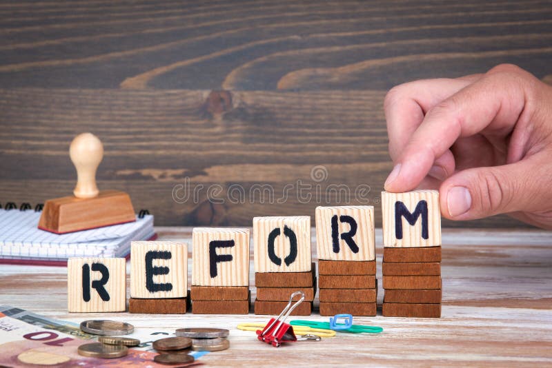 Reform Concept. Wooden Letters on the Office Desk, Informative and ...