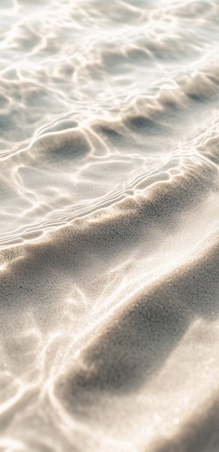 Refracted Sunlight Patterns on Rippling Sandy Beach Surface Stock Image ...