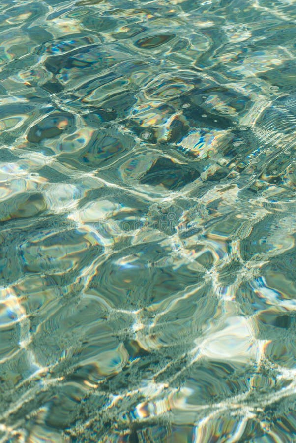 Refraction of Light in Clear Water with Small Waves. Background Stock ...