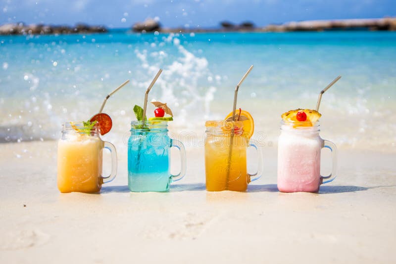 Refresh Cocktail Drinks on Sandy Beach with Splashing Water Stock Photo ...