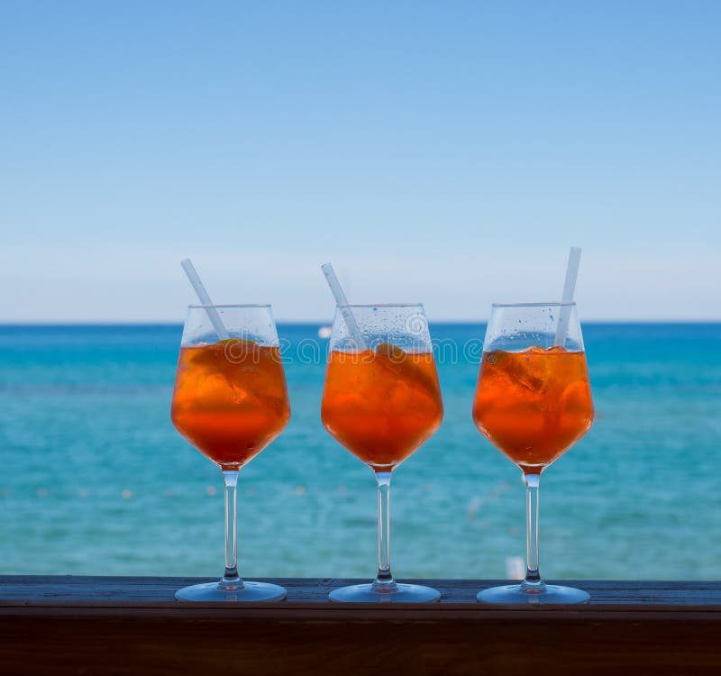 Refreshing Aperitif Aperol Spritz on a Background of Blue Sea. Stock ...