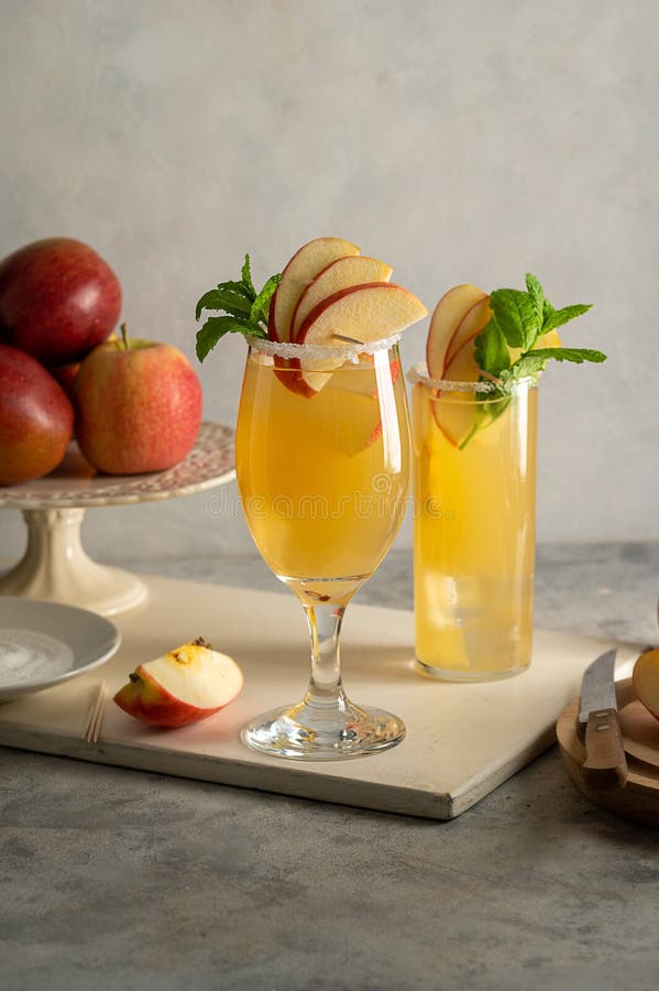 Refreshing Apple Cocktail Drinks with Fresh Red Apples Stock ...