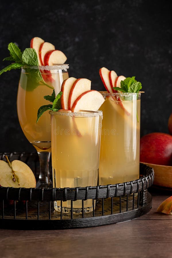 Refreshing Apple Cocktail Drinks with Fresh Red Apples, Dark Background ...