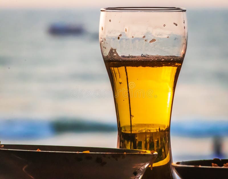 Refreshing Beer at Sunset Over the Ocean – Goa, India Stock Image ...