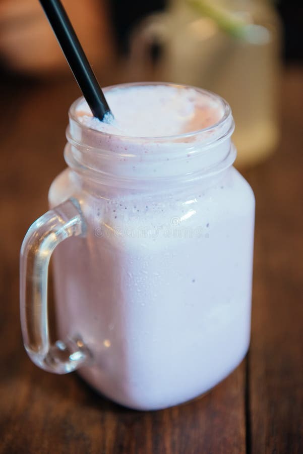 Refreshing Blueberry Milkshake in a Glass Stock Photo - Image of tube ...