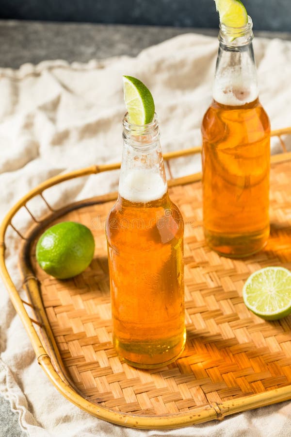 Refreshing Boozy Mexican Lager Beer with Lime Stock Photo - Image of ...