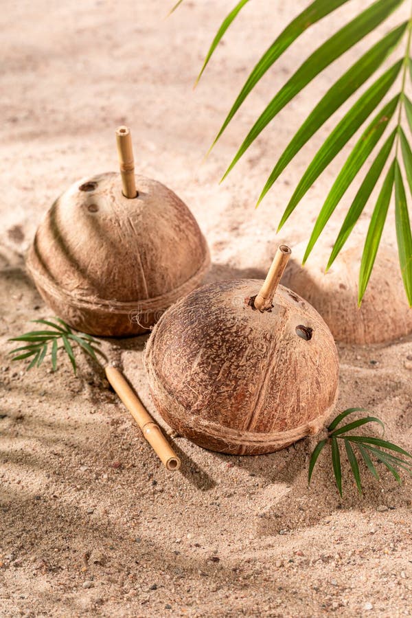 Refreshing Coconut Milk in Shell on a Tropical Beach Stock Photo ...