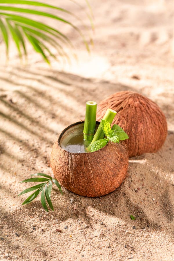 Refreshing and Delicious Coconut Milk in Shell Served on Beach Stock ...