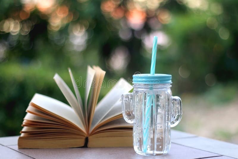 Refreshing Drink and Book stock photo. Image of leisure - 189001278