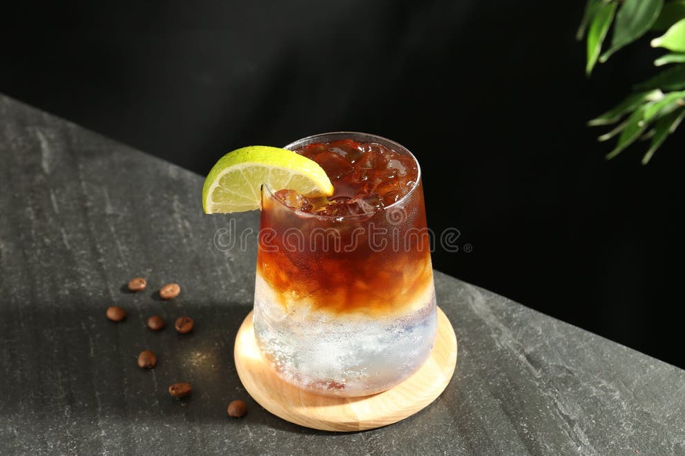 Refreshing Espresso Tonic Drink with Slice of Lime and Coffee Beans on ...