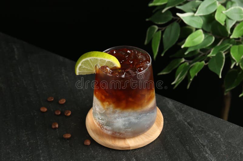 Refreshing Espresso Tonic Drink with Slice of Lime and Coffee Beans on ...