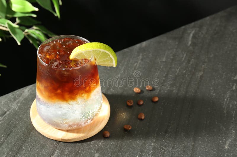 Refreshing Espresso Tonic Drink with Slice of Lime and Coffee Beans on ...