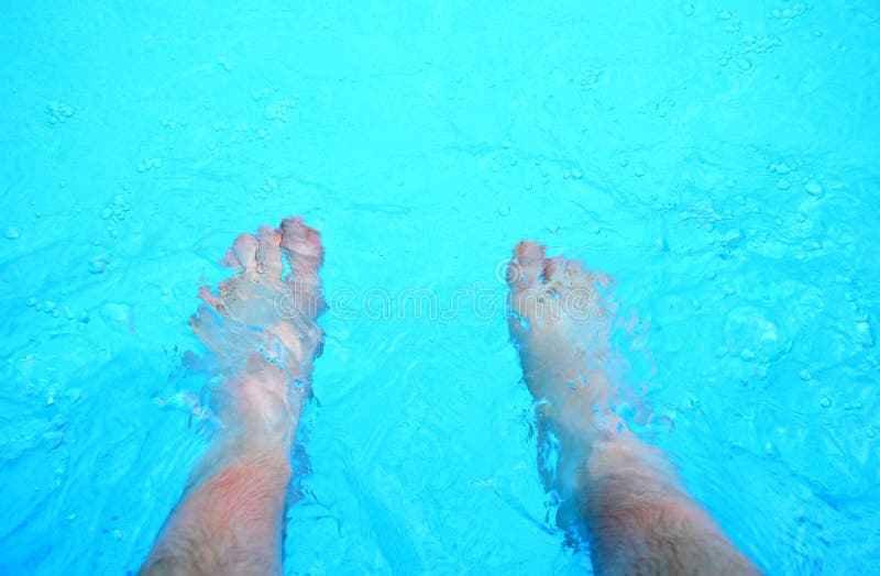 Refreshing feet in a pool stock photo. Image of legs - 95062310