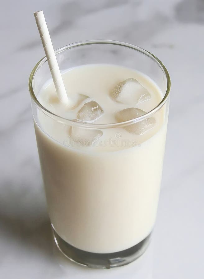 Refreshing Glass of Cold Milk with Ice Cubes and Straw, Perfect for Hot ...