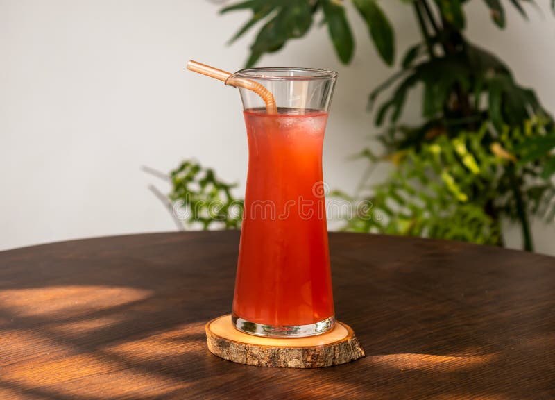 Refreshing Glass of Raspberry Lemonade with Straw Isolated on Wooden ...