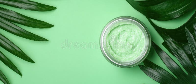 Refreshing Green Cream in a Jar Surrounded by Tropical Leaves on a ...