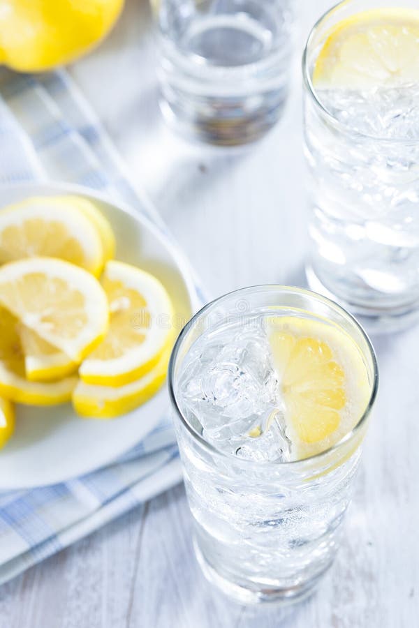 Refreshing Ice Cold Water with Lemon Stock Image - Image of clear ...