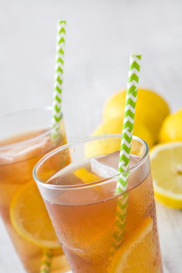 Refreshing Iced Tea with Lemon on White Wood Stock Photo - Image of ...
