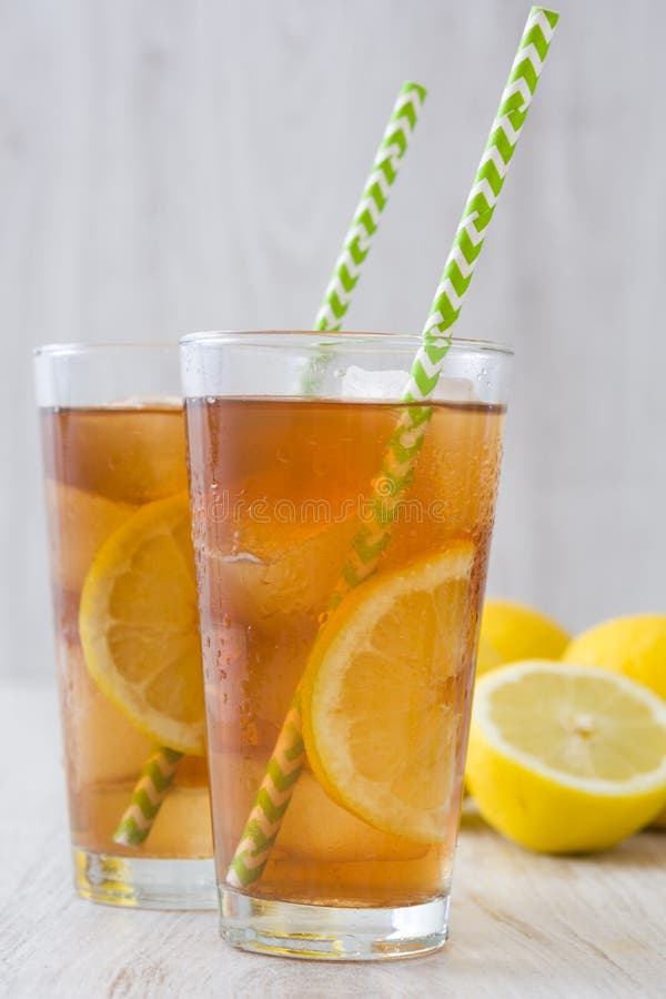 Refreshing Iced Tea with Lemon on White Wood Stock Photo - Image of ...