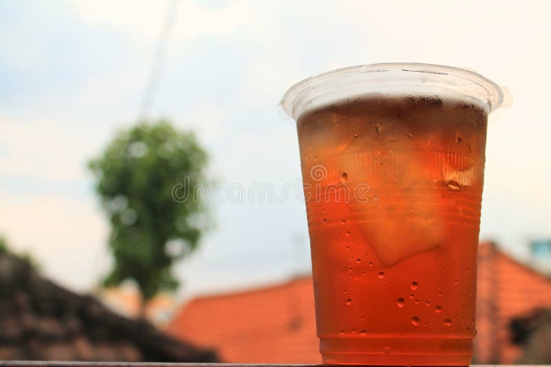 Refreshing Iced Tea in a Plastic Cup Stock Photo - Image of flowing ...