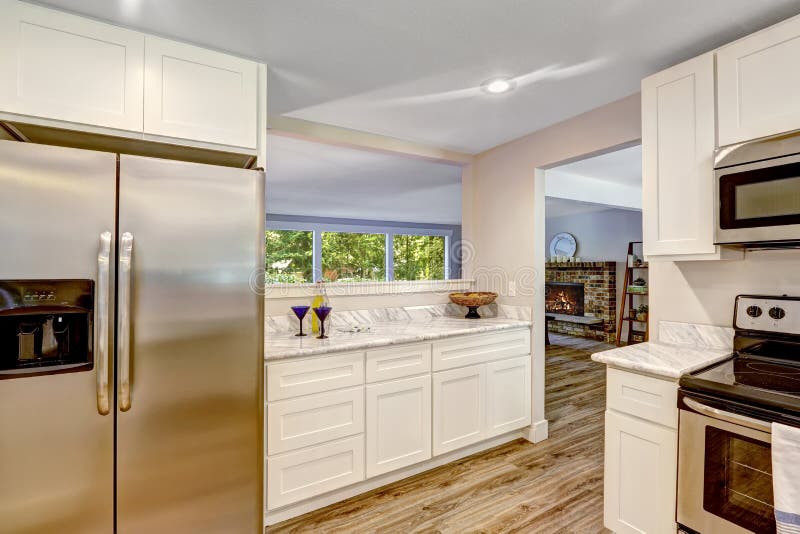 Refreshing Kitchen Interior with White Cabinets. Stock Photo - Image of ...