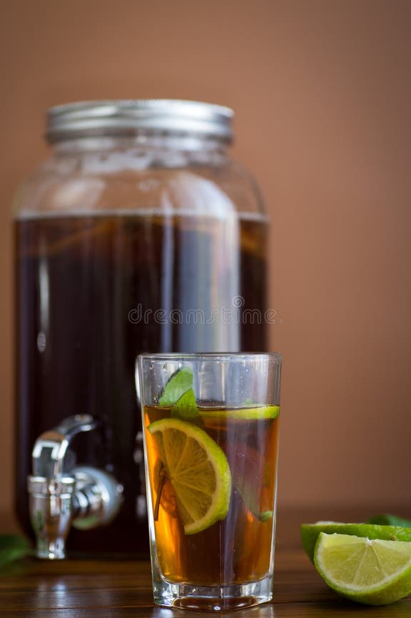 Refreshing Kombucha in a Glass Jar and a Glass with Lime Stock Image ...