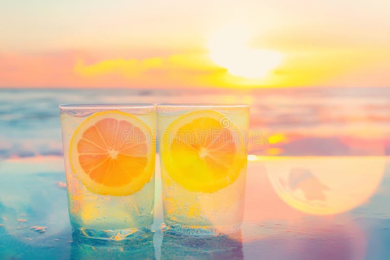 A Refreshing Lemon Drink Layered with a Beach Sunset in Double Exposure ...