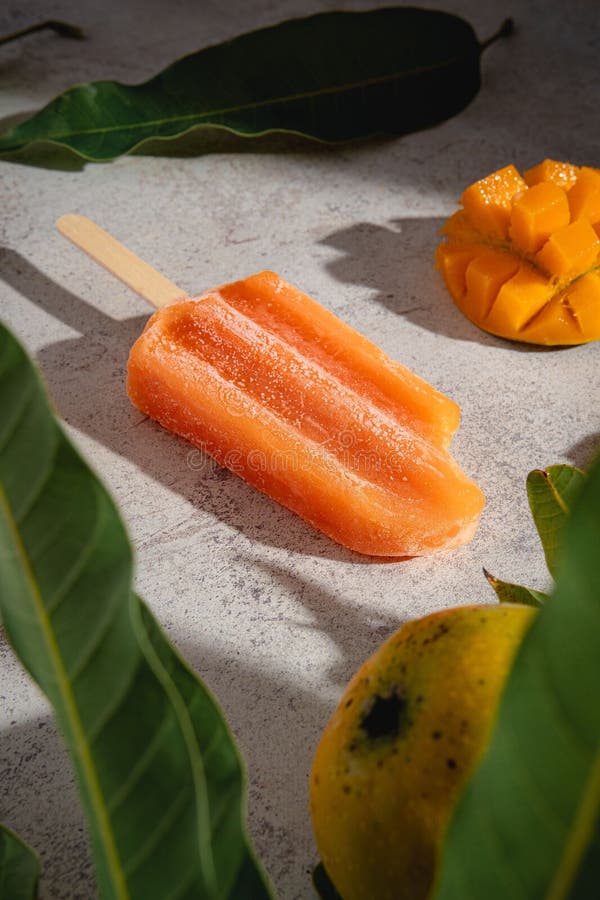Refreshing mango ice cream stock photo. Image of leaves - 277090964