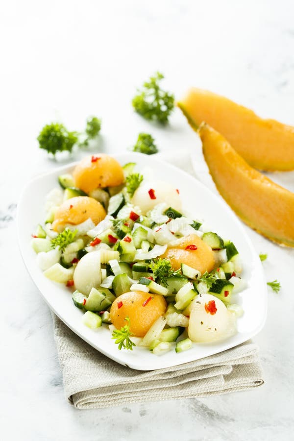 Refreshing Melon Salad with Cucumber and Chili Stock Photo - Image of ...
