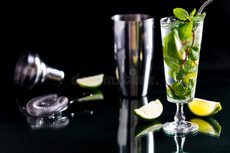 A Refreshing Mojito Cocktail in a Tall Glass with a Shaker Bottle in ...