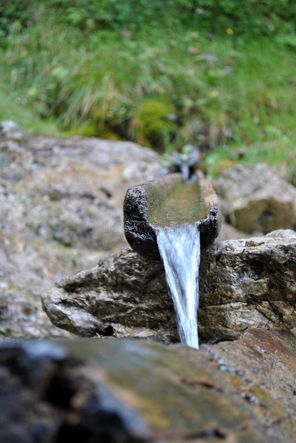 Refreshing mountain spring stock image. Image of fluid - 25885863