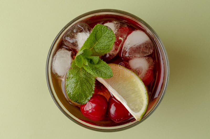 Refreshing Red Cocktail with Sparkling Water and Ice Garnished with a ...