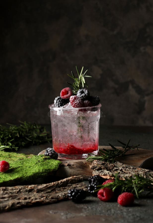Refreshing Summer Drink with Syrup, Raspberry, Blackberry and Ice on ...