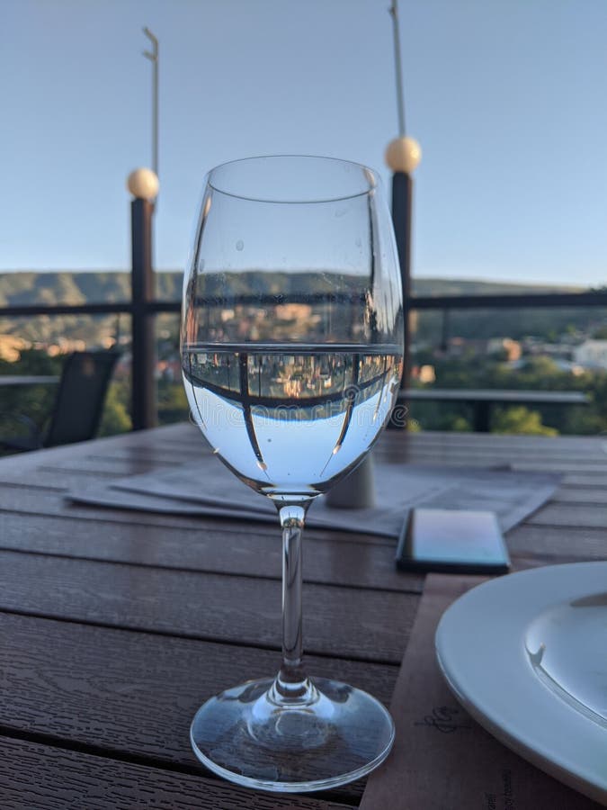 A Refreshing Summer Scene Capturing the Reflection of an Open Terrace ...