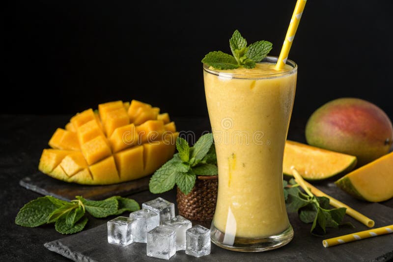 Refreshing Tropical Mango Drink in Tall Glass with Ice Cubes Stock ...