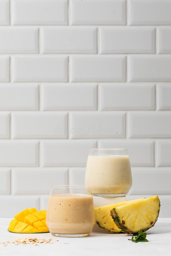 Refreshing Tropical Smoothie with Mango and Pineapple in Modern Kitchen ...
