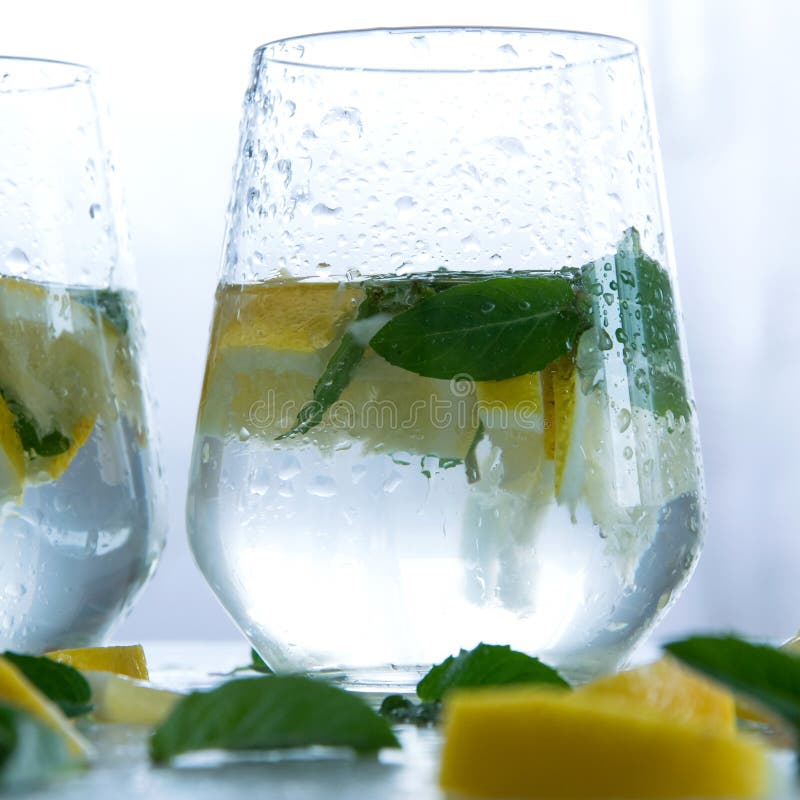 Refreshment Ice Drink/cocktail with Lemons and Mint Stock Image - Image ...
